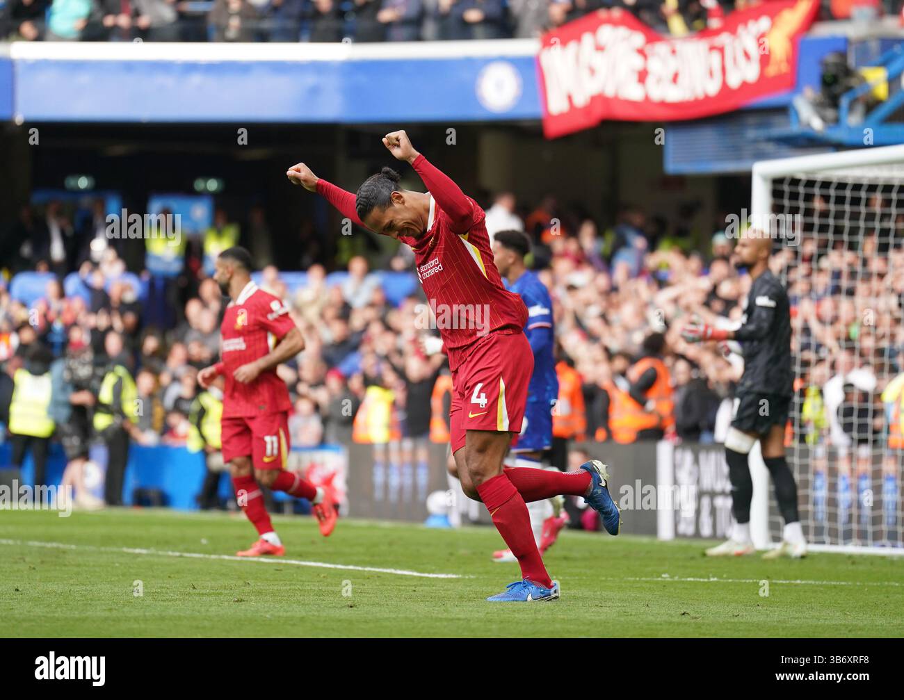 Liverpool's Virgil van Dijk celebrates scoring their side's first goal ...