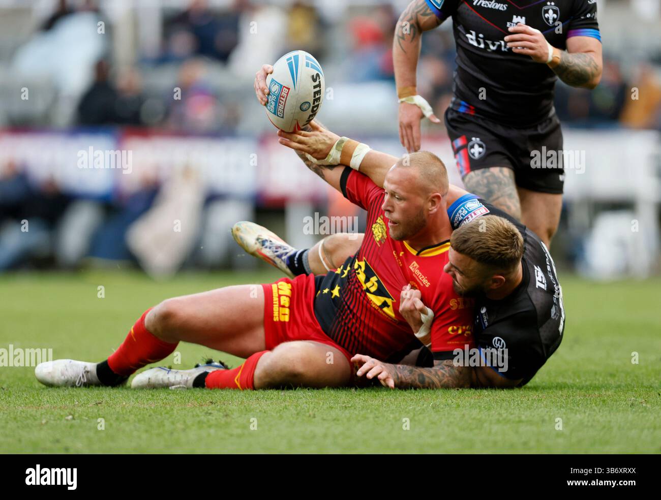Castleford Tigers' Joe Westerman (left) is tackled during the Betfred ...