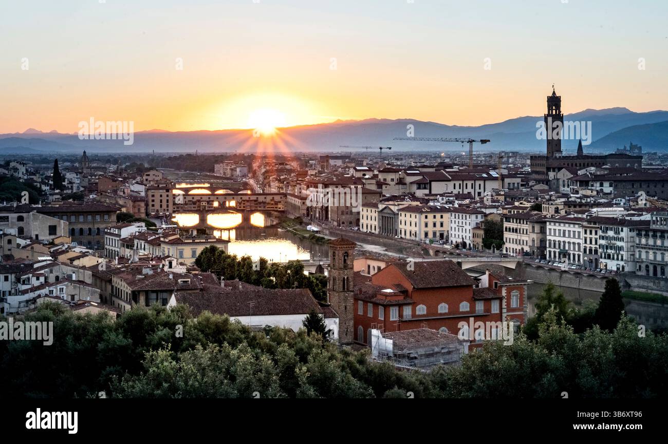 A breathtaking sunset view over Florence, Italy, showcasing the Arno ...