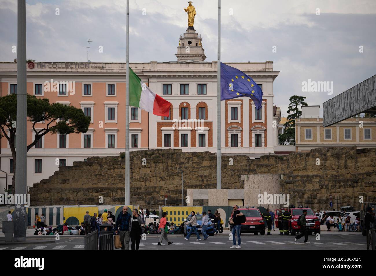 Rome, Italy. 27th Apr, 2025. Italian and EU flags are seen flying half ...