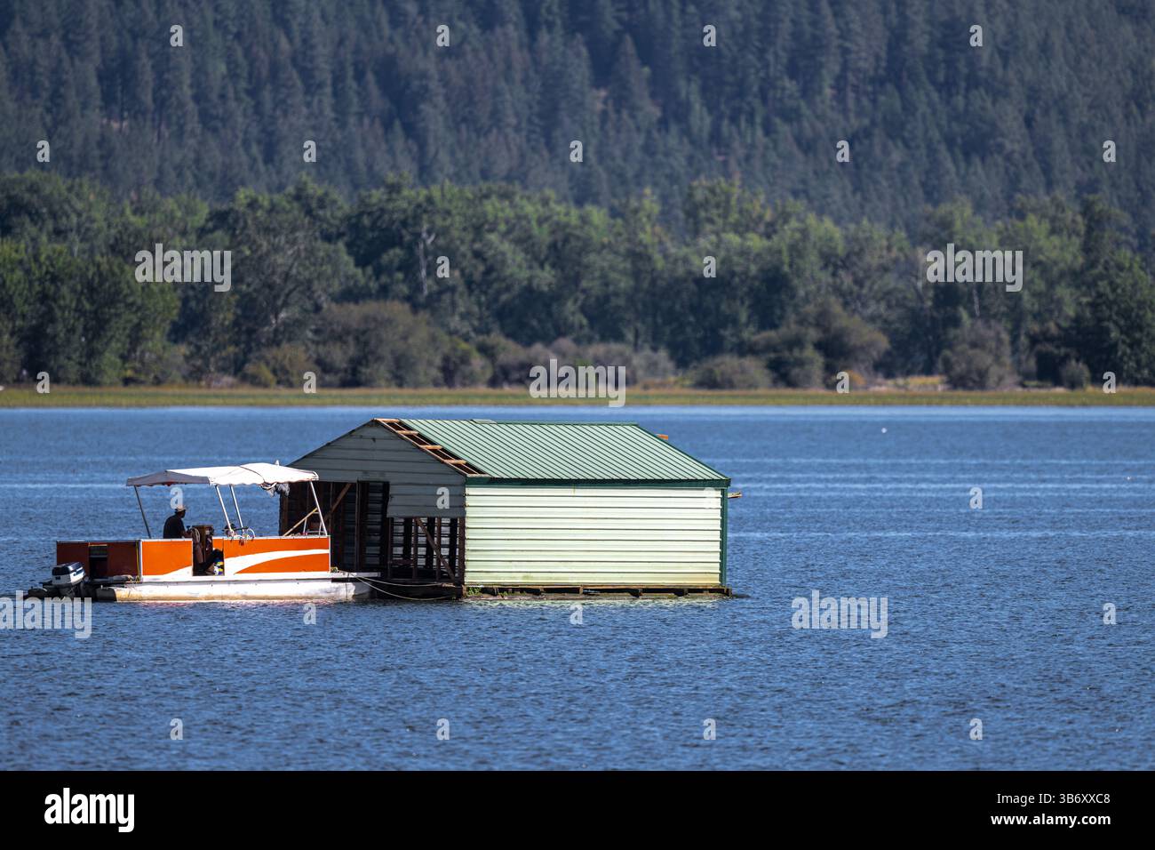 Moving a Boathouse across a Lake in Idaho Stock Photo - Alamy