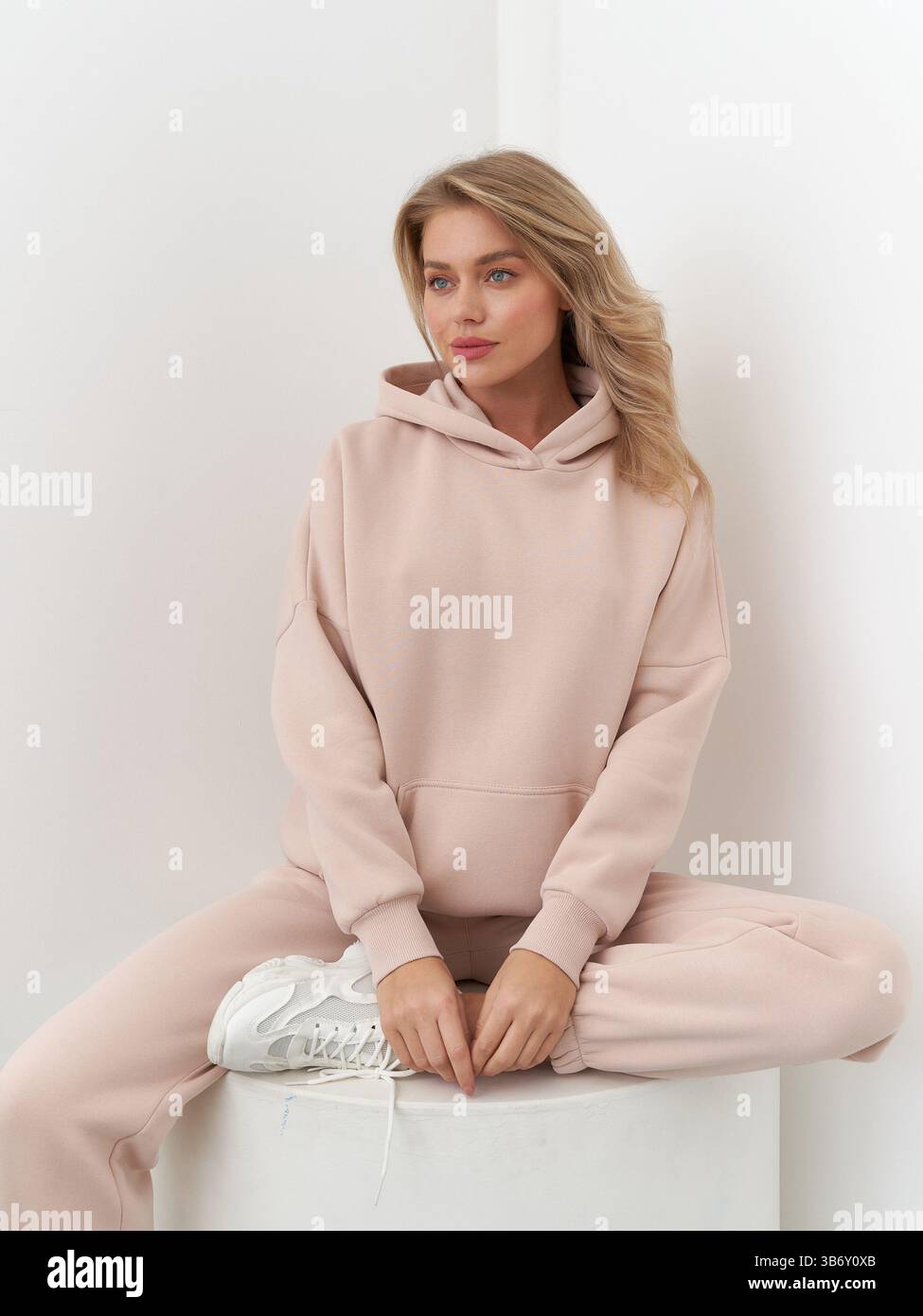 Stylish female model poses gracefully in a chic studio setting Stock ...