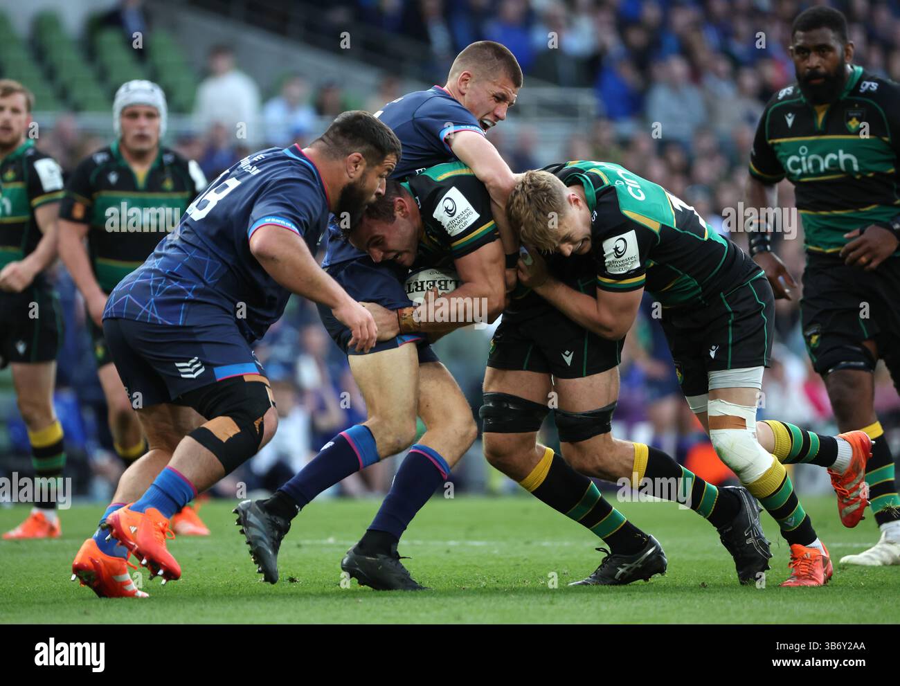 Northampton Saints' Josh Kemeny is tackled by Leinster's Sam ...