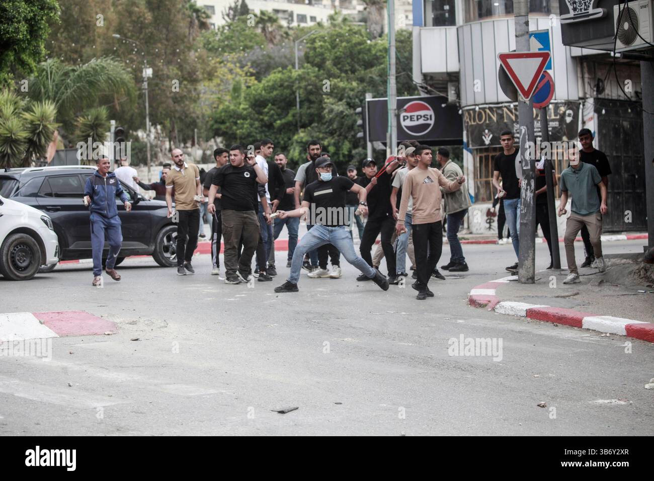 Nablus, Palestine. 04th May, 2025. Palestinians throw stones at Israeli ...