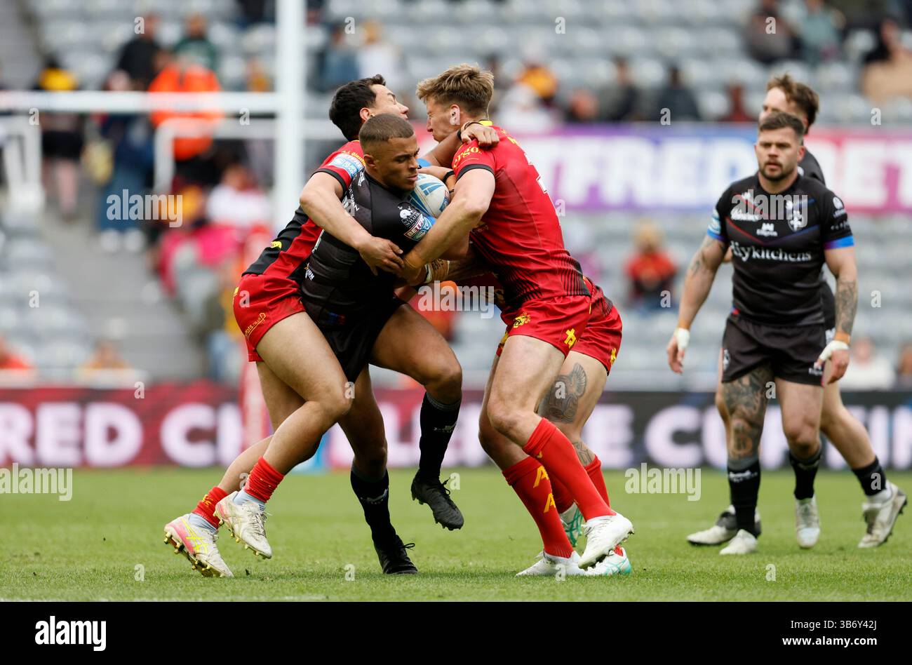 Wakefield Trinity's Corey Hall (centre) is tackled during the Betfred ...
