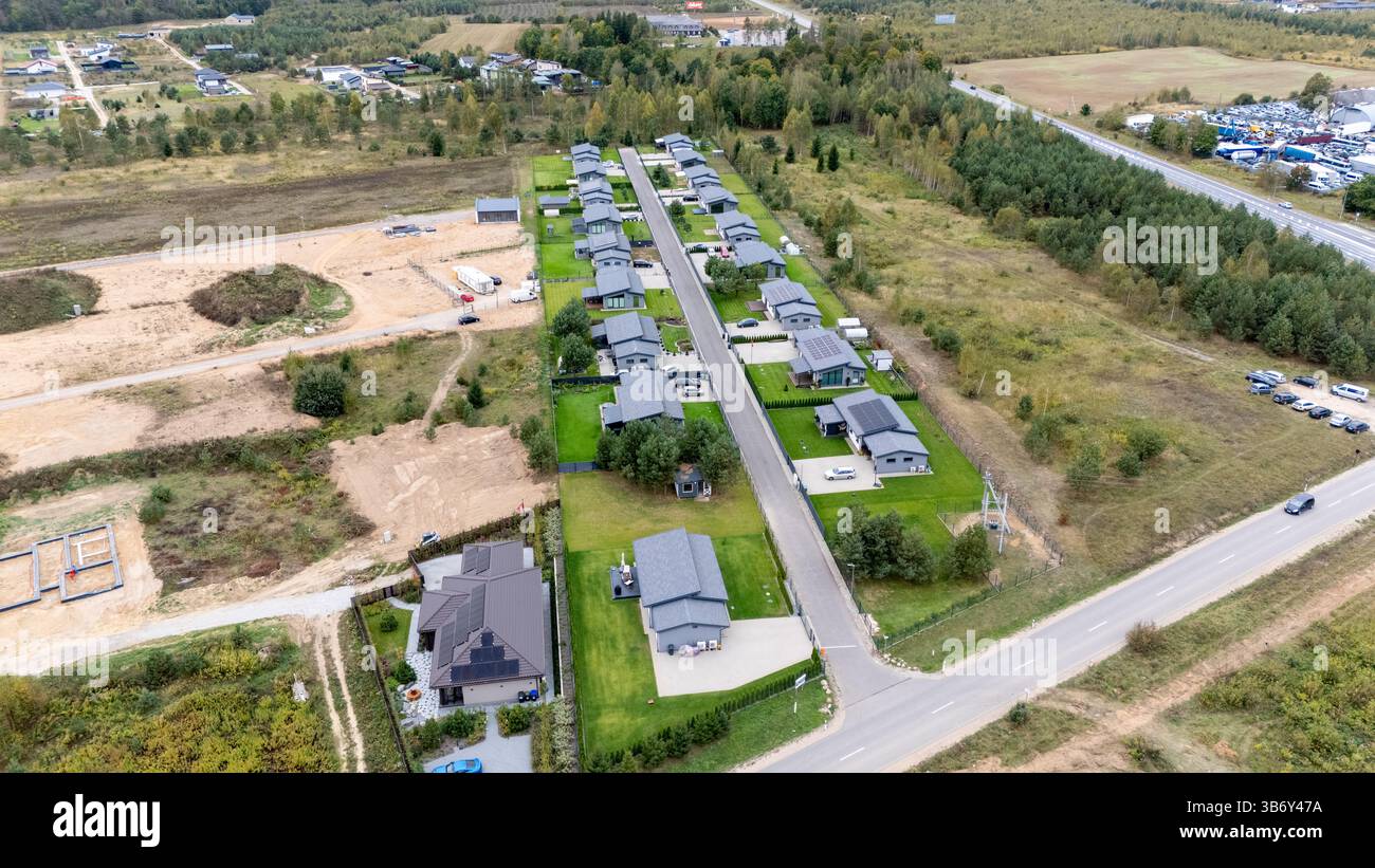 Aerial view of a suburban neighborhood featuring modern houses with ...
