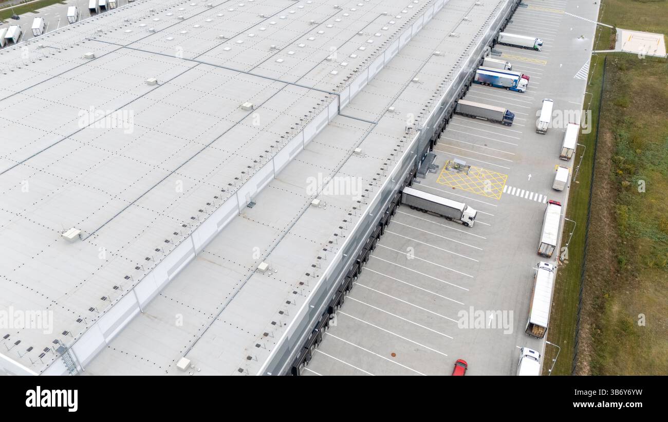 Aerial view of a large industrial warehouse with multiple loading docks ...