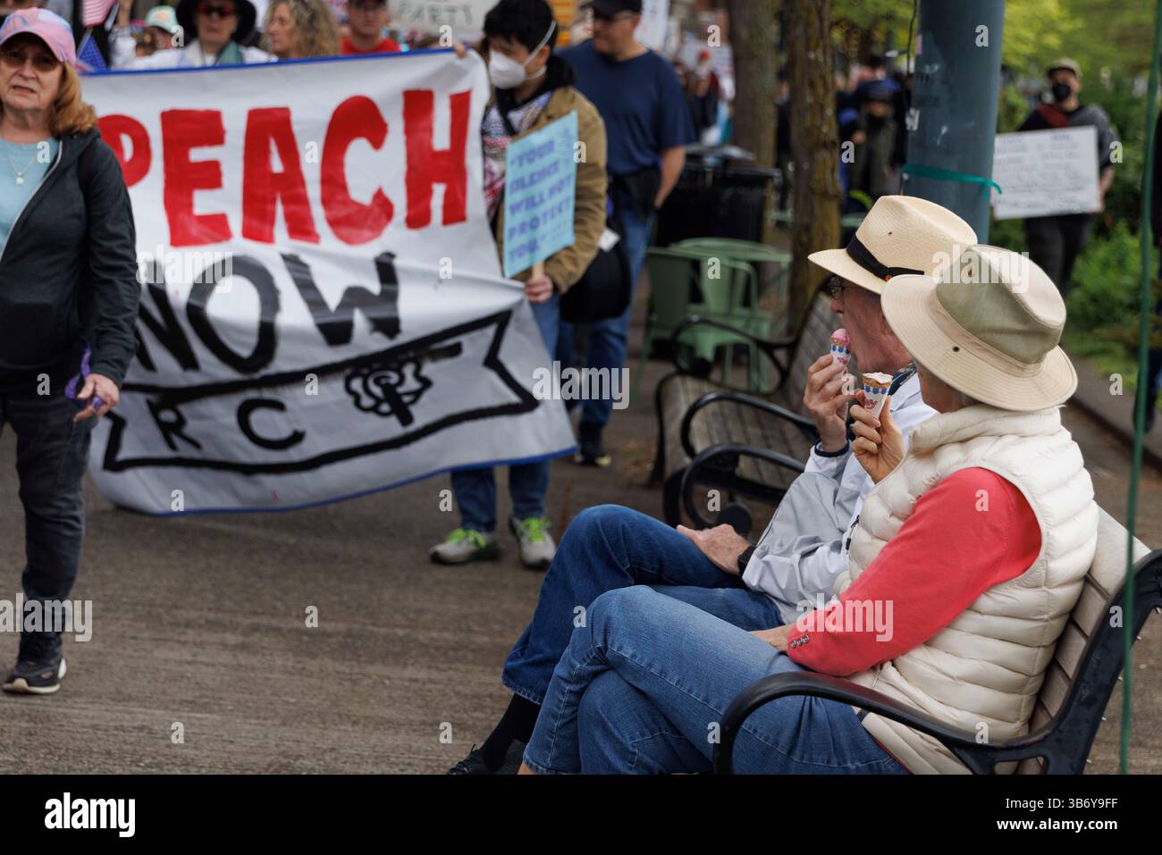 Portland, USA. 03rd May, 2025. An elderly couple eat ice cream cones as ...