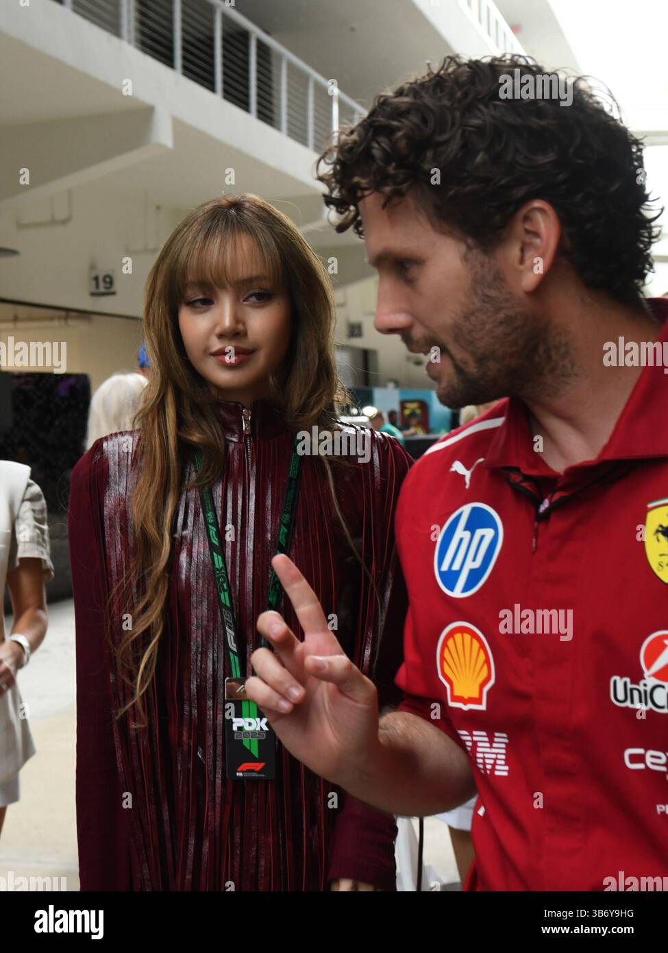 Thai rapper, singer, dancer, and actress Lisa walks through the Paddock ...