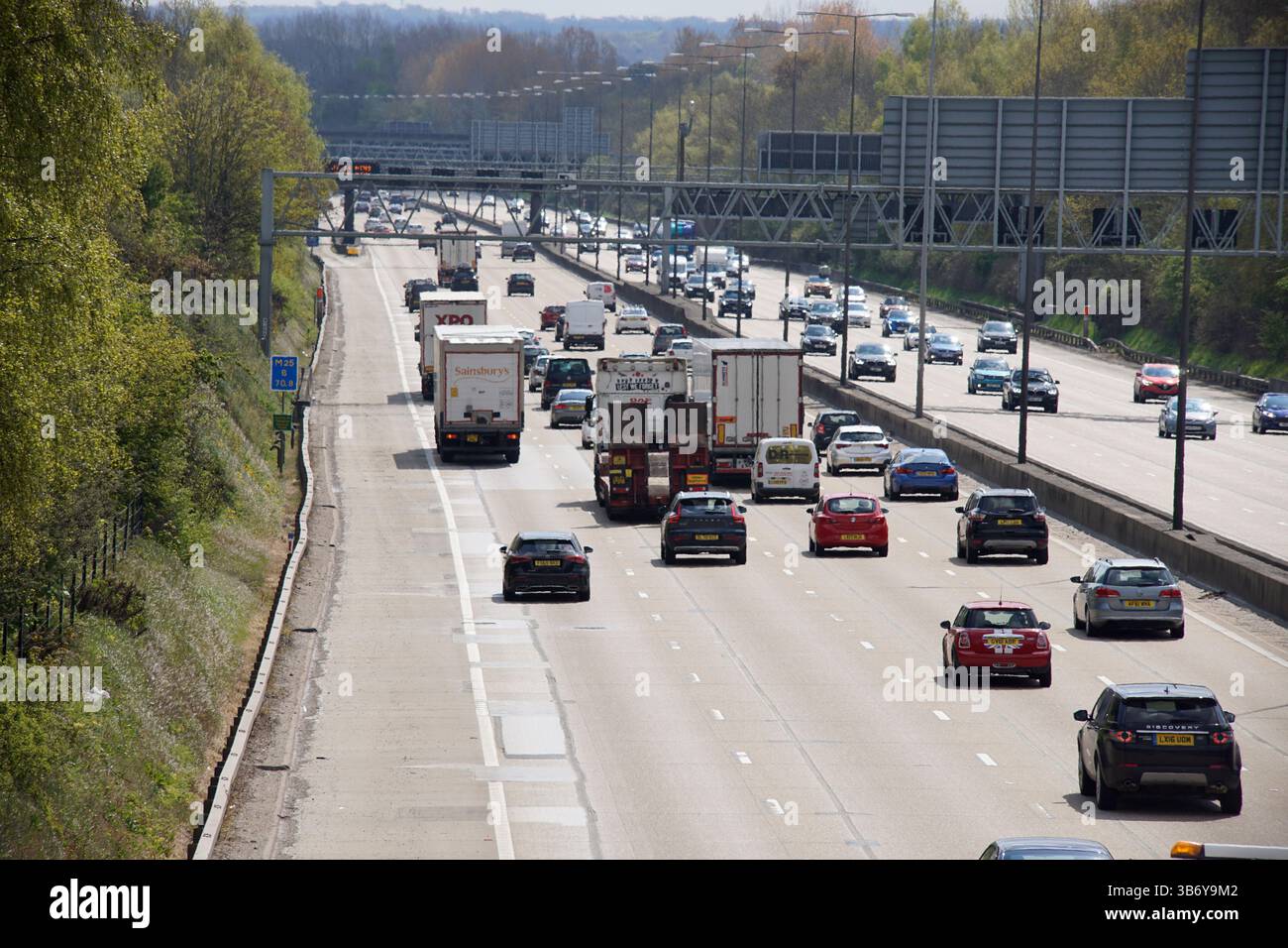 Traffic on a Busy Multi-Lane Highway with Vehicles and Greenery. M25 ...