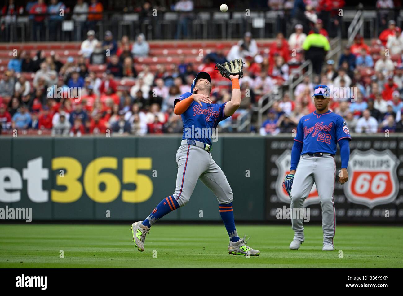New York Mets second baseman Jeff McNeil, left, catches a popup by St ...