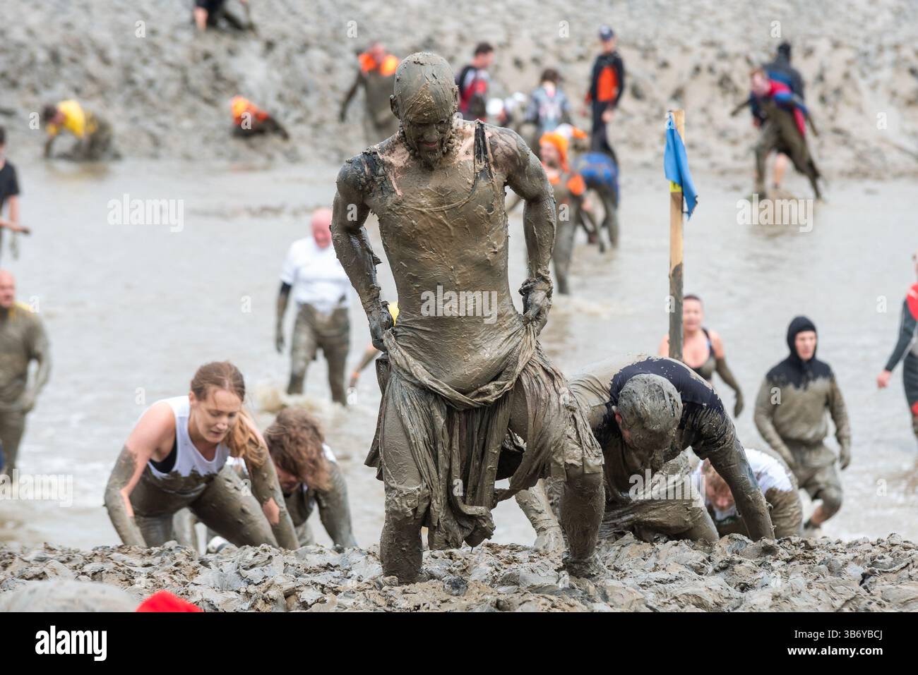 Maldon Mud Race 2025. Participants covered in mud Stock Photo - Alamy