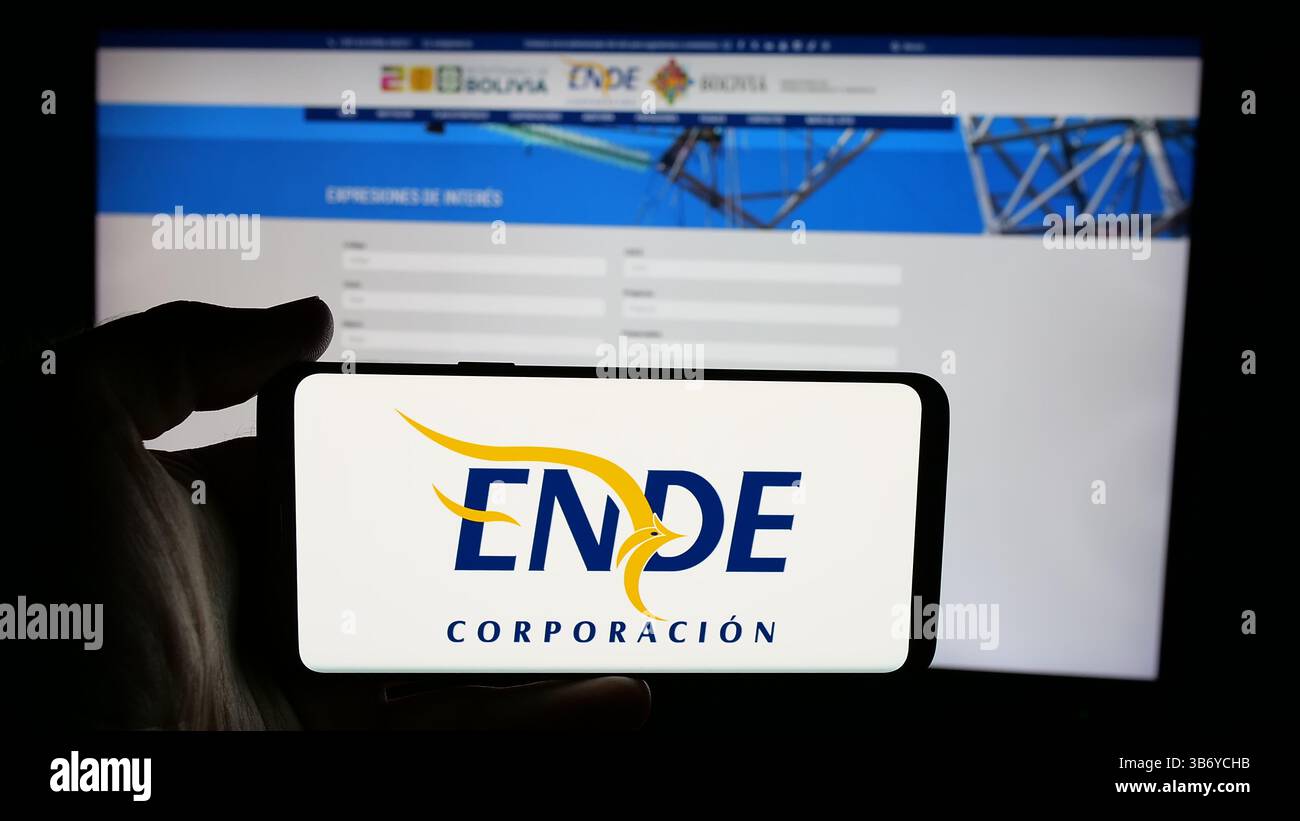 In this photo illustration, a person is holding a cellphone with the ...