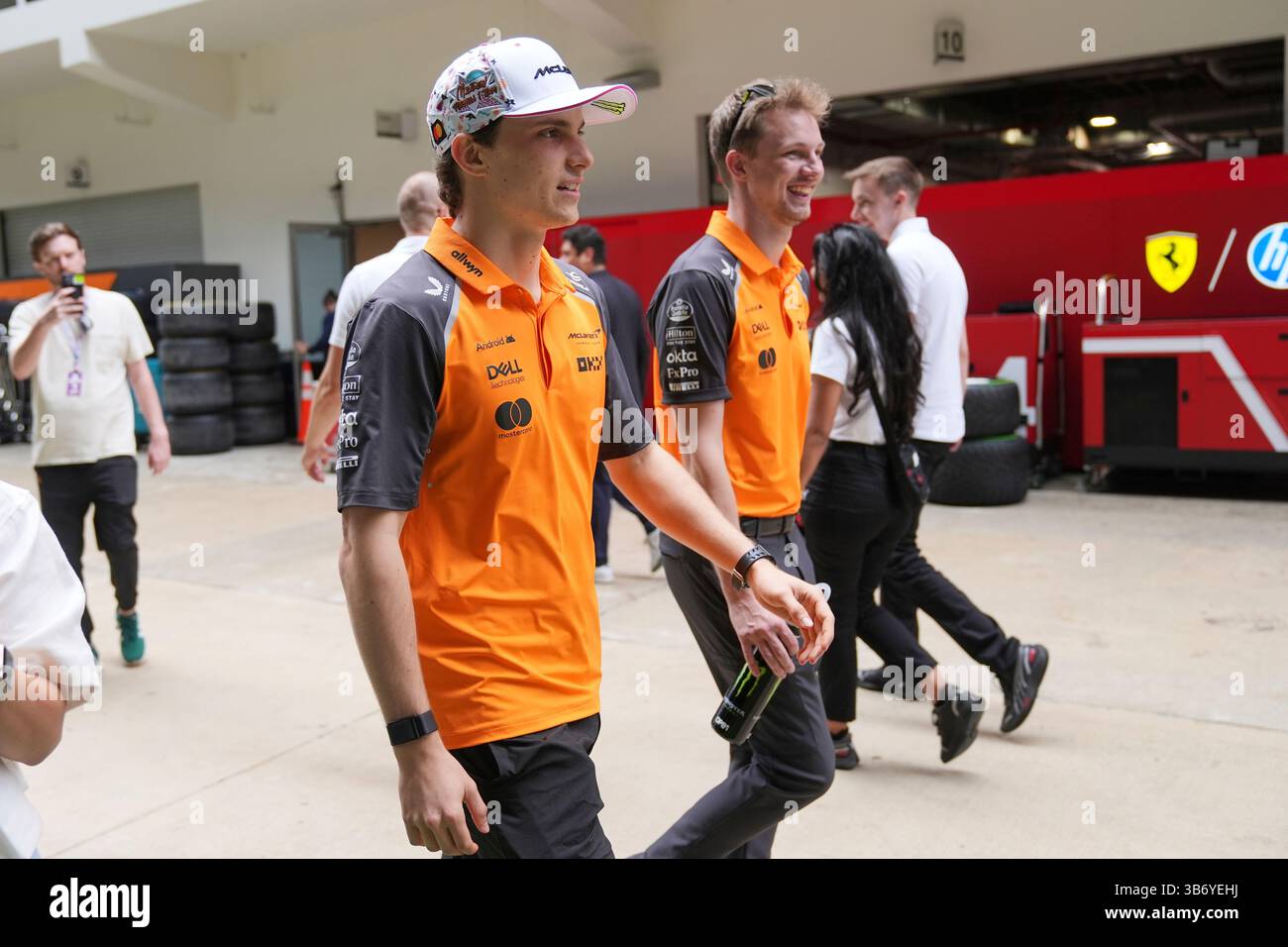 McLaren driver Oscar Piastri of Australia walks near the pit before the ...