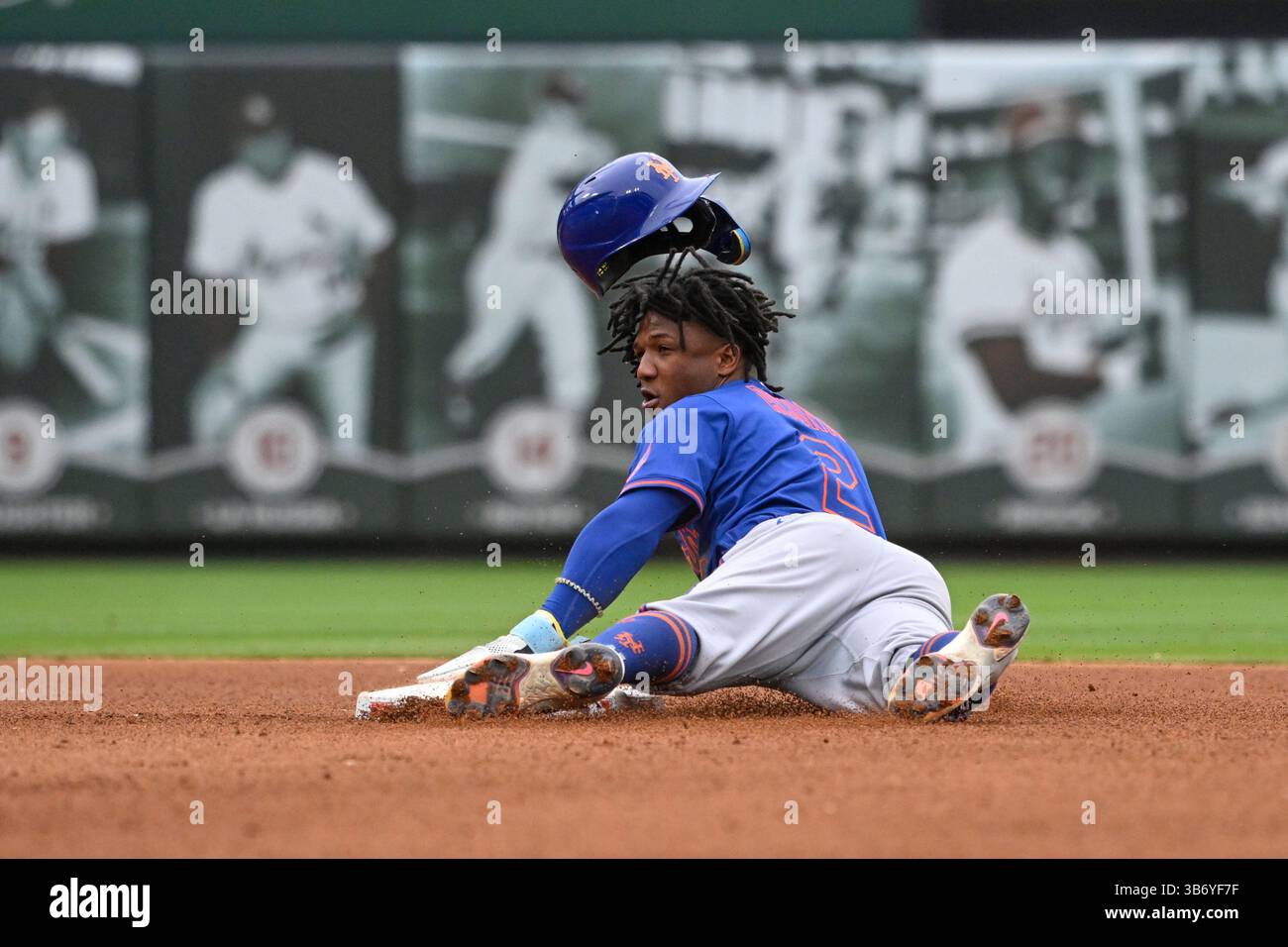 New York Mets' Luisangel Acuña looks back after stealing second base in ...