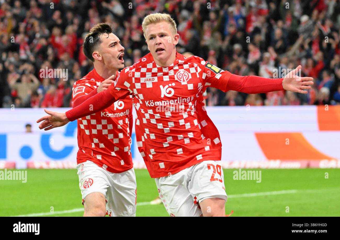 Mainz's Jonathan Burkhardt celebrates scoring a goal, during the German ...