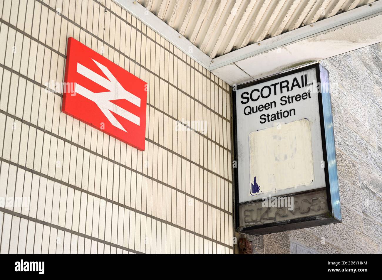 An old Car Parking sign at the entrance to Queen Street Railway Station ...