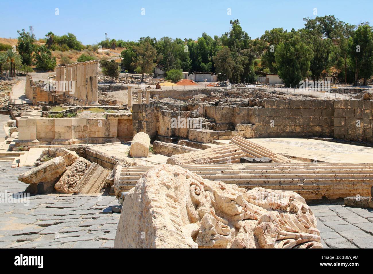 Collapsed Roman columns among ruins in the archaeological site of Beit ...