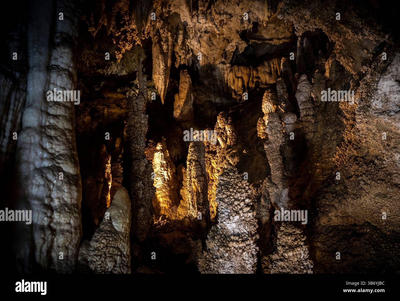 A stunning view of a cave interior featuring stalactites and ...