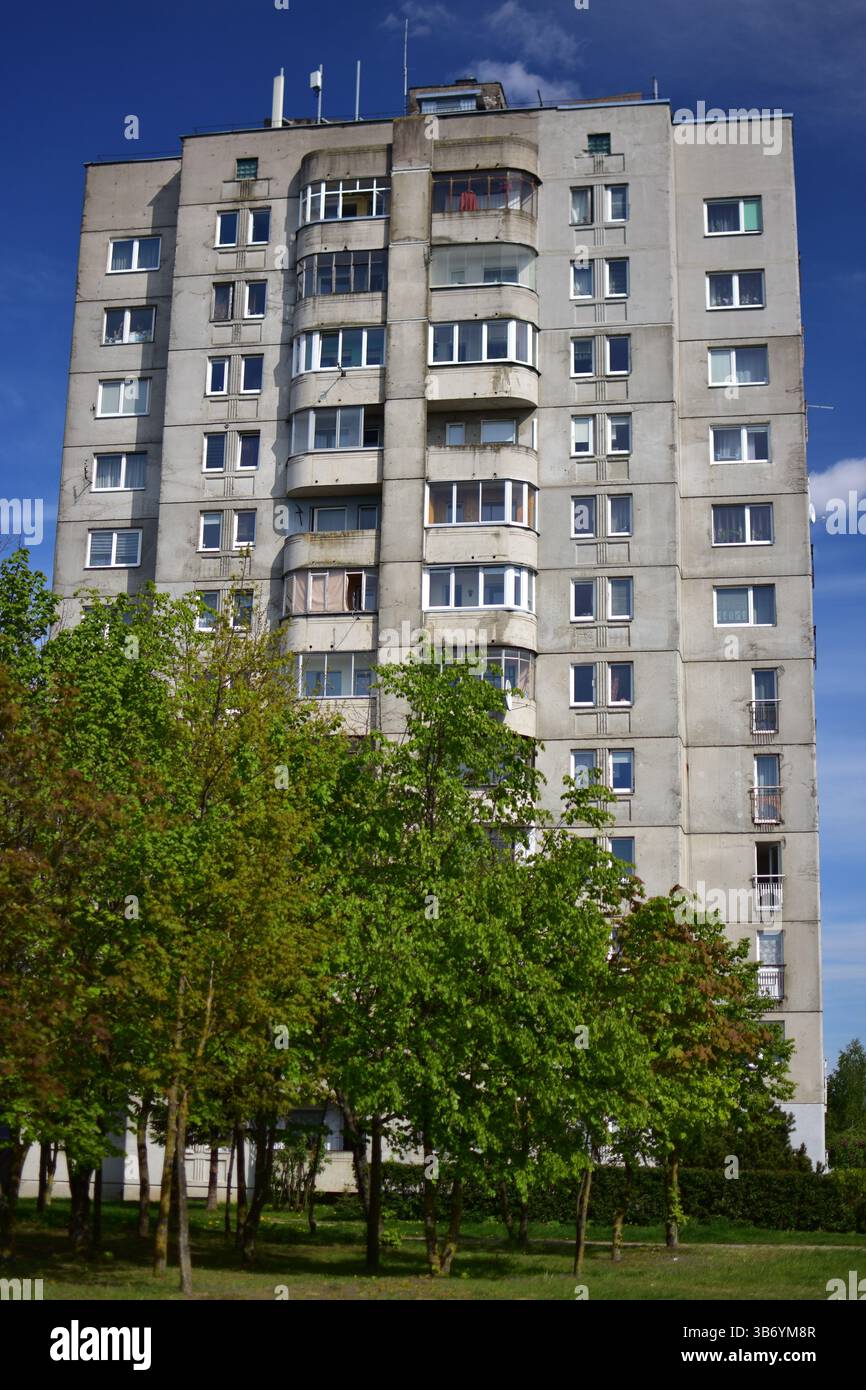 Portrait of old soviet style 12-story apartment house in sunny summer ...