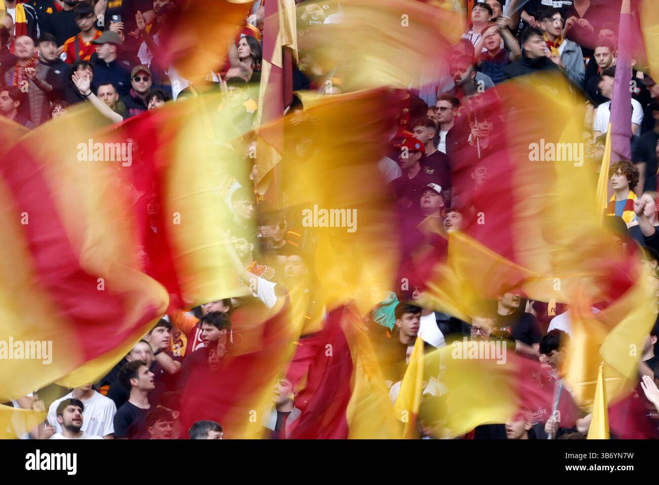 Rome, Italy. 4th May, 2025. Roma fans wave flags during the Italian ...