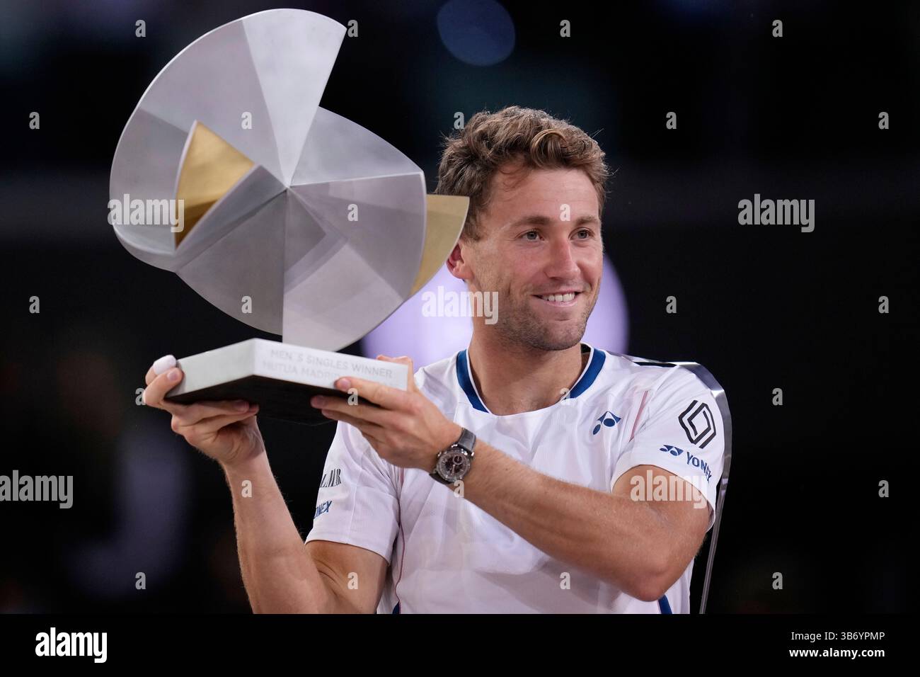 Norway's Casper Ruud holds the trophy after winning the Madrid Open ...