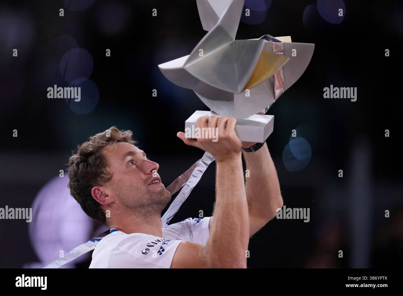 Norway's Casper Ruud holds the trophy after winning the Madrid Open ...