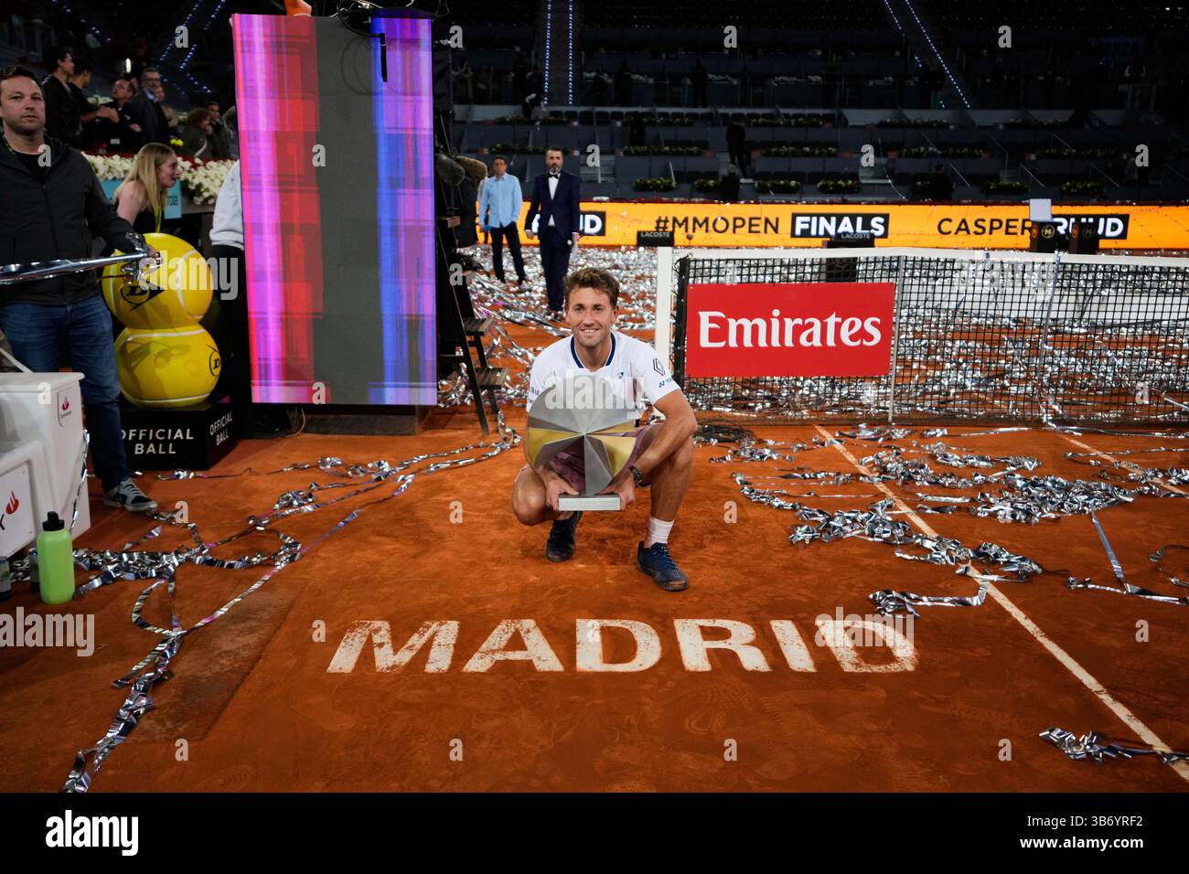Norway's Casper Ruud holds the trophy after winning the Madrid Open ...