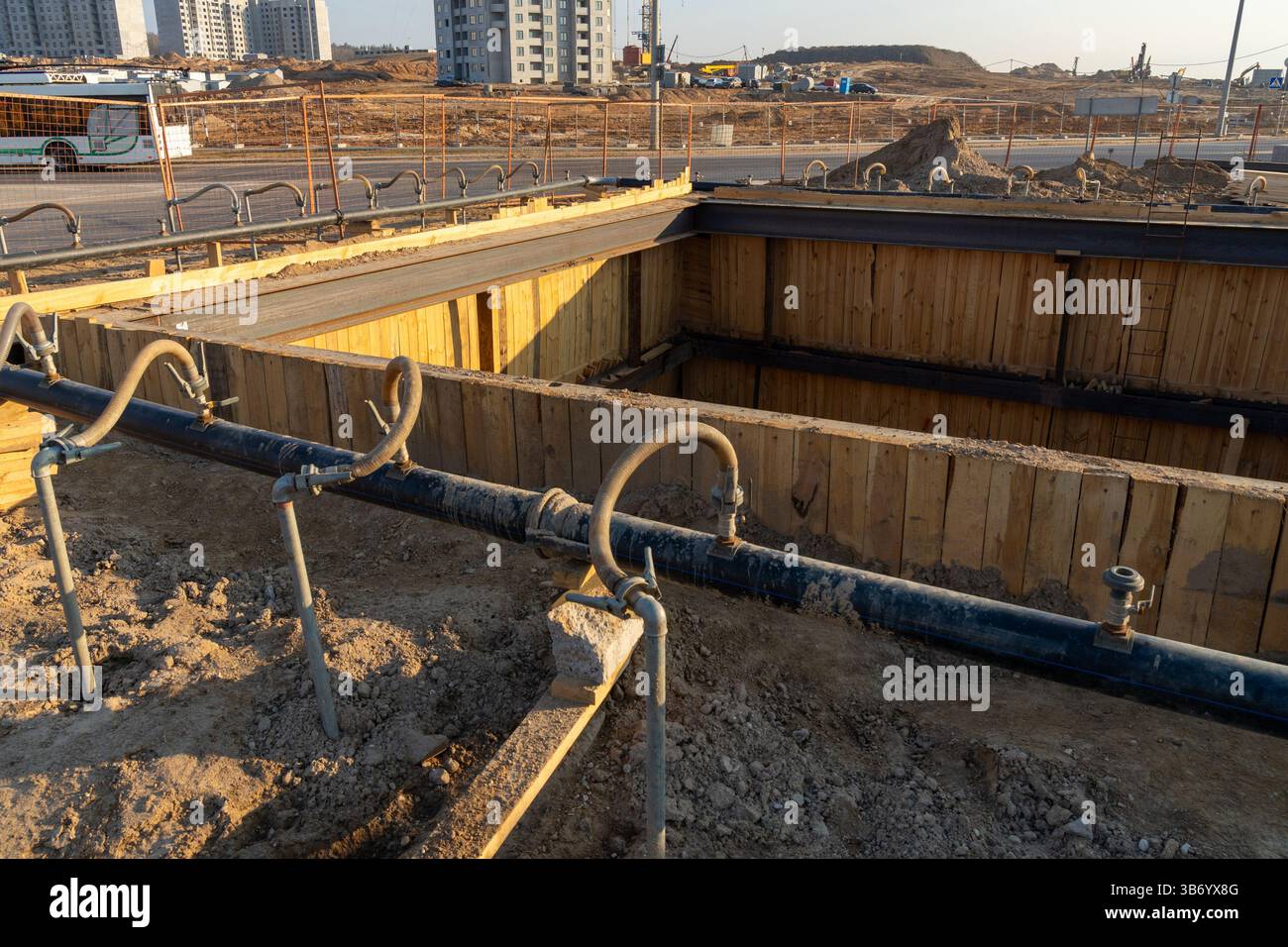 A close-up view of a series of flexible hoses connected to a pipe at a ...
