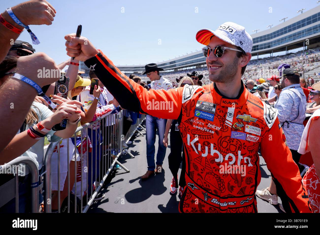 Ross Chastain, right, fist-bumps fans before a NASCAR Cup Series auto ...