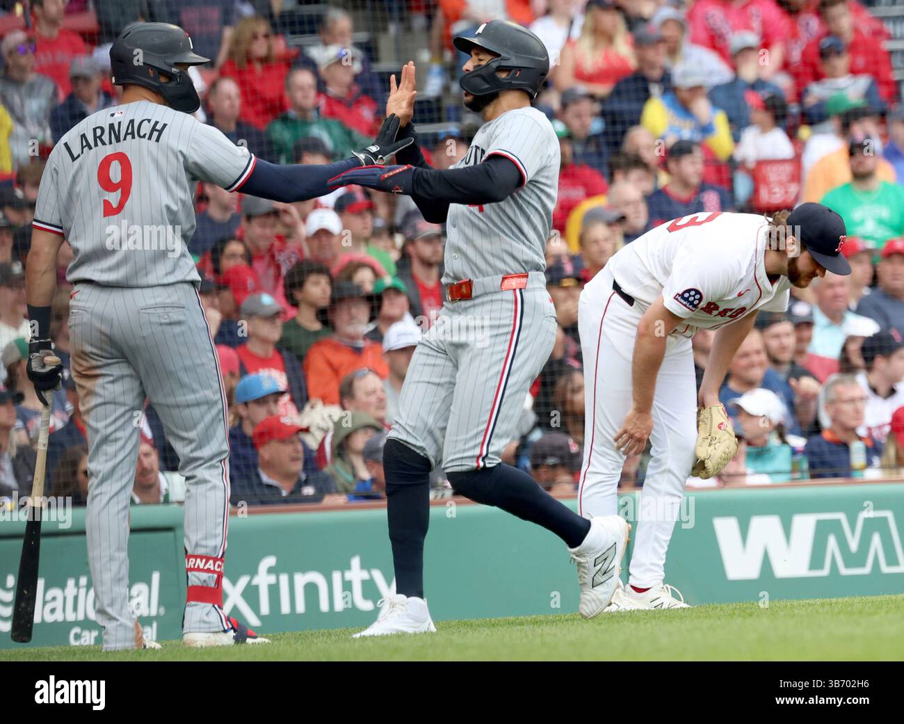 Boston Red Sox pitcher Justin Slaten, right, reacts as Minnesota Twins ...