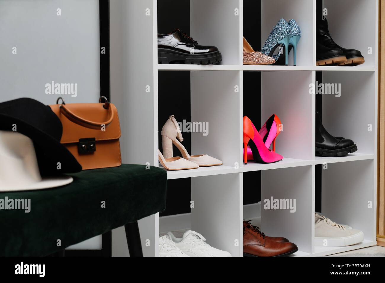 Shoe storage. Shelving unit with different footwear, accessories and ...