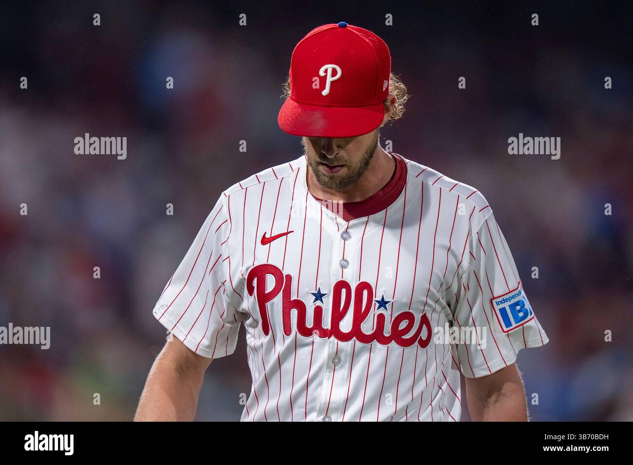 Philadelphia Phillies starting pitcher Aaron Nola looks down during the ...