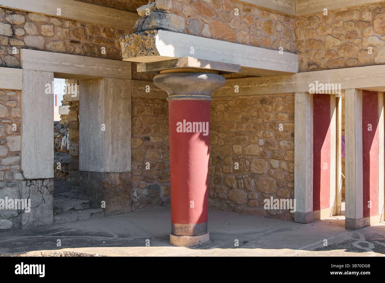 The iconic red columns and stone structures of Knossos Palace stand as ...