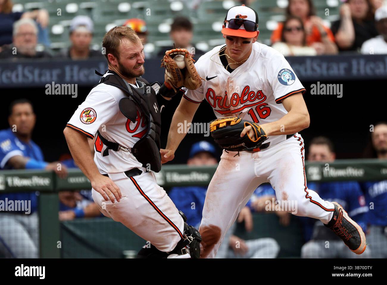 Baltimore Orioles catcher Maverick Handley, left, catches the ball for ...
