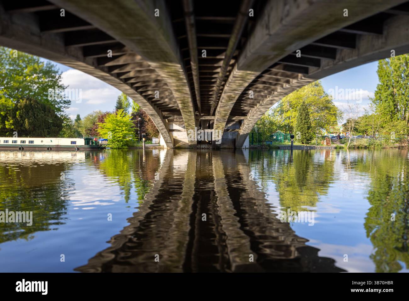 Low-angle view from water level looking up at the symmetrical structure ...