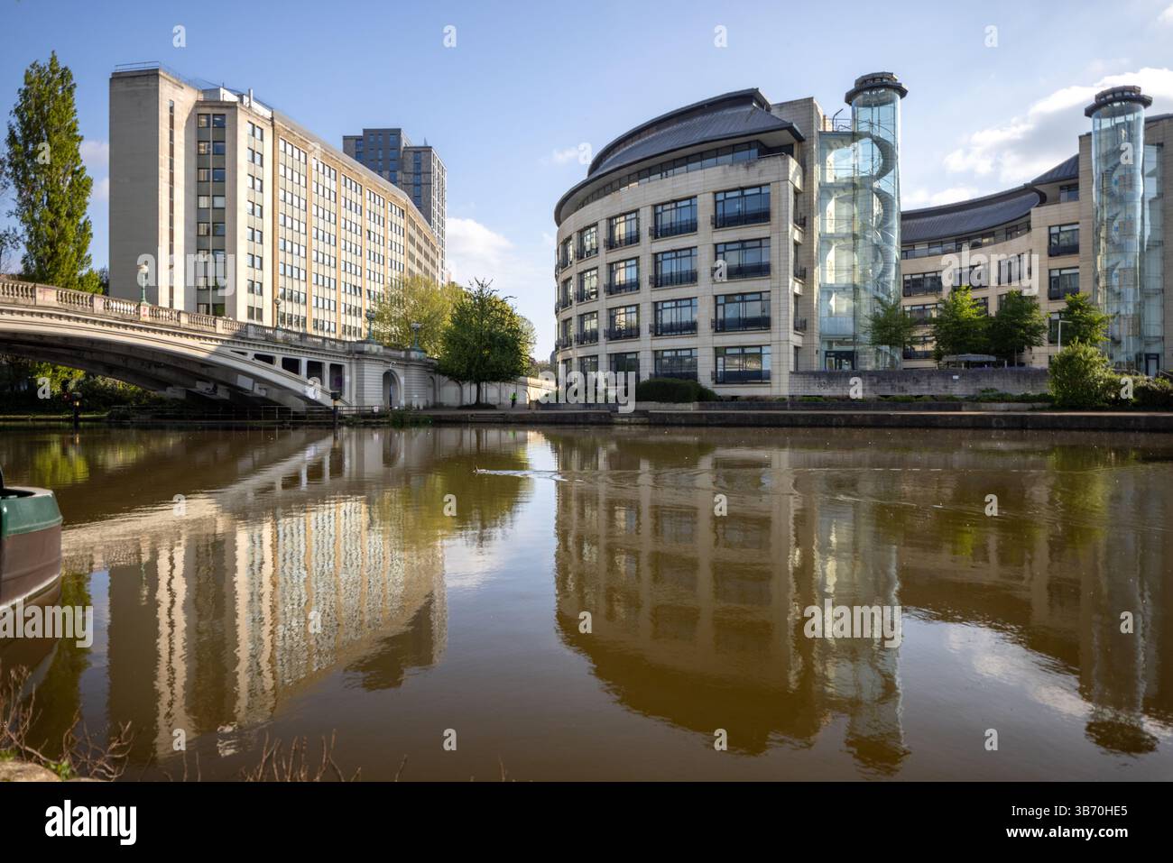 Riverside scene featuring modern curved office buildings with glass ...
