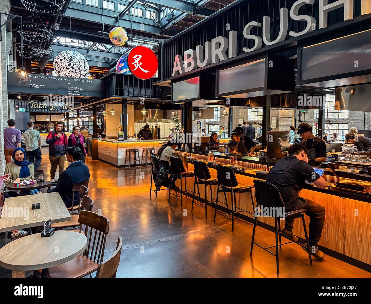 Waterworks Food Hall. Interior view of the modern food hall with people ...