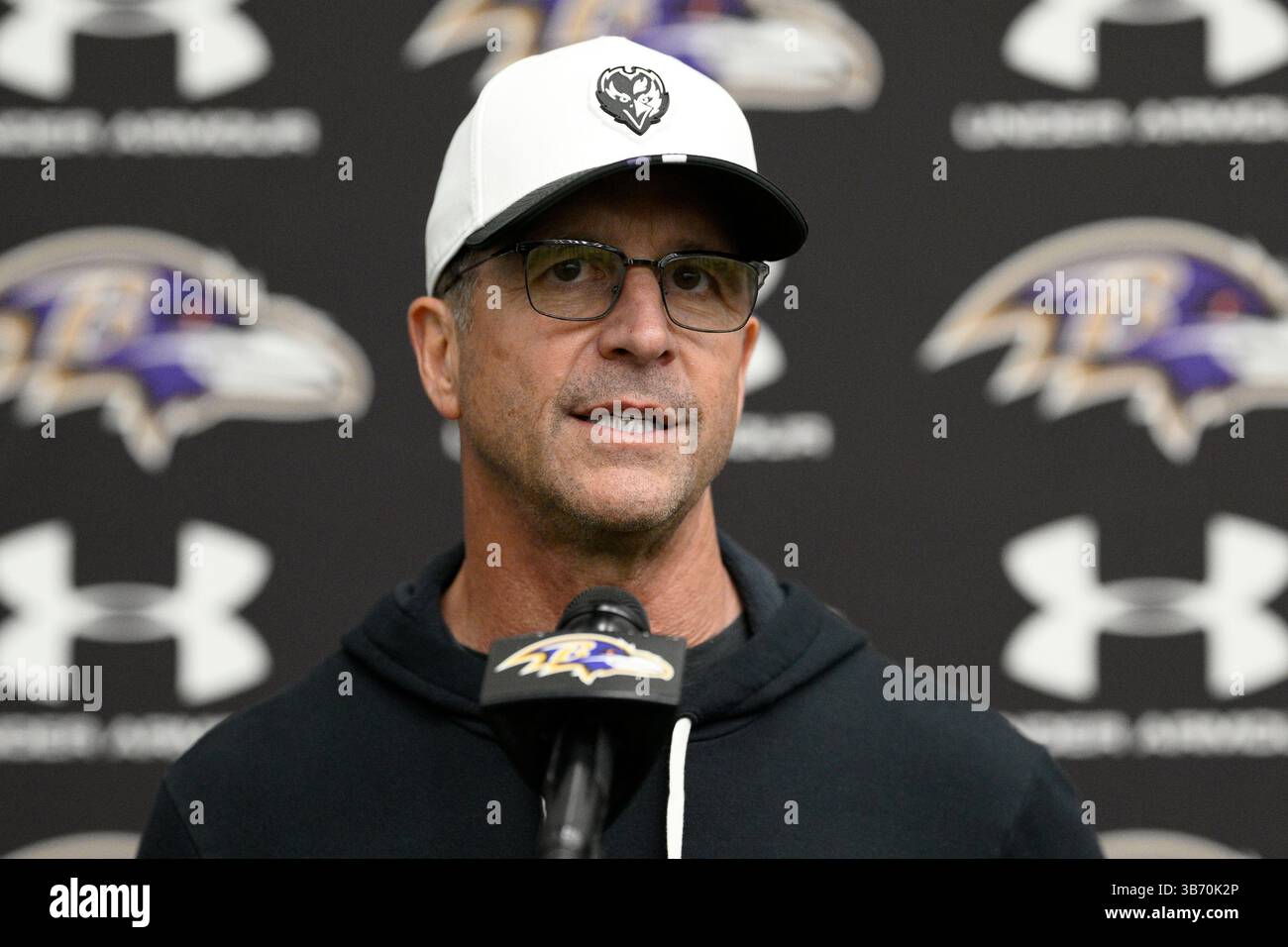 Baltimore Ravens head coach John Harbaugh talks to the media after an ...