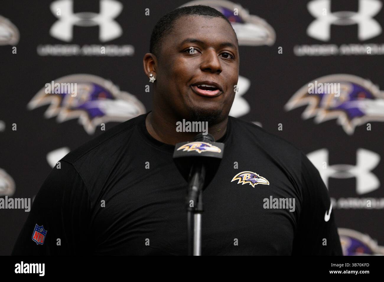 Baltimore Ravens defensive tackle Aeneas Peebles talks to the media ...