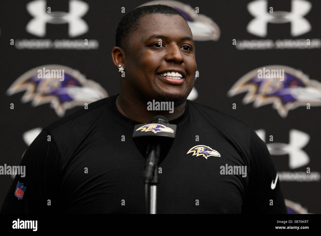 Baltimore Ravens defensive tackle Aeneas Peebles talks to the media ...