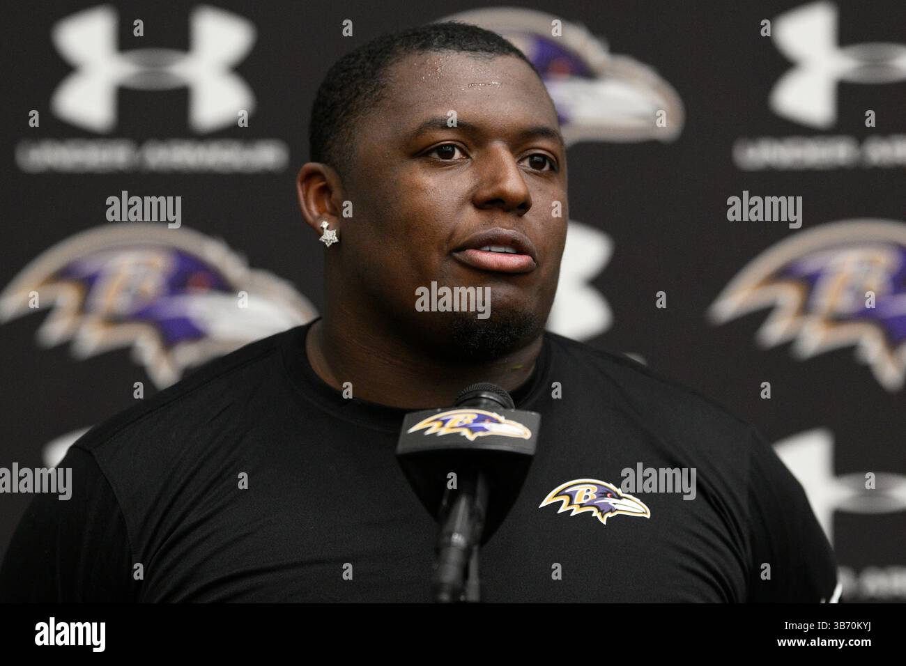 Baltimore Ravens defensive tackle Aeneas Peebles talks to the media ...