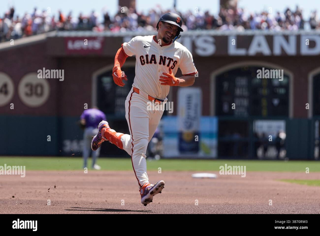 San Francisco Giants' Willy Adames smiles after hitting a home run ...