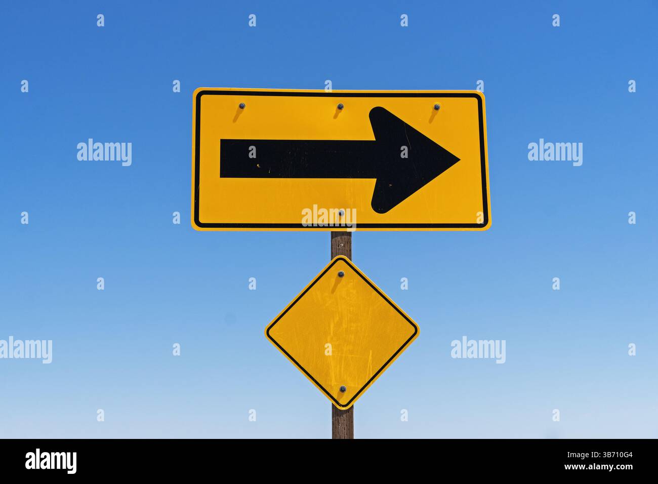 yellow and black reflective warning road sign with right arrow and ...