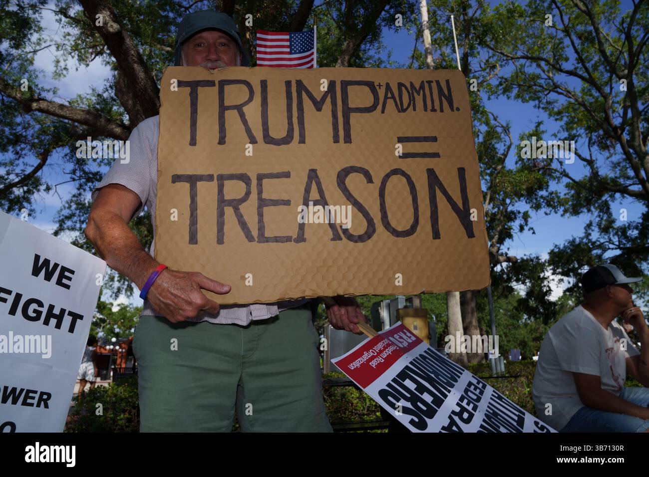 St Petersburg, Florida, USA. 3rd May, 2025. A May Day Protester Holds A ...