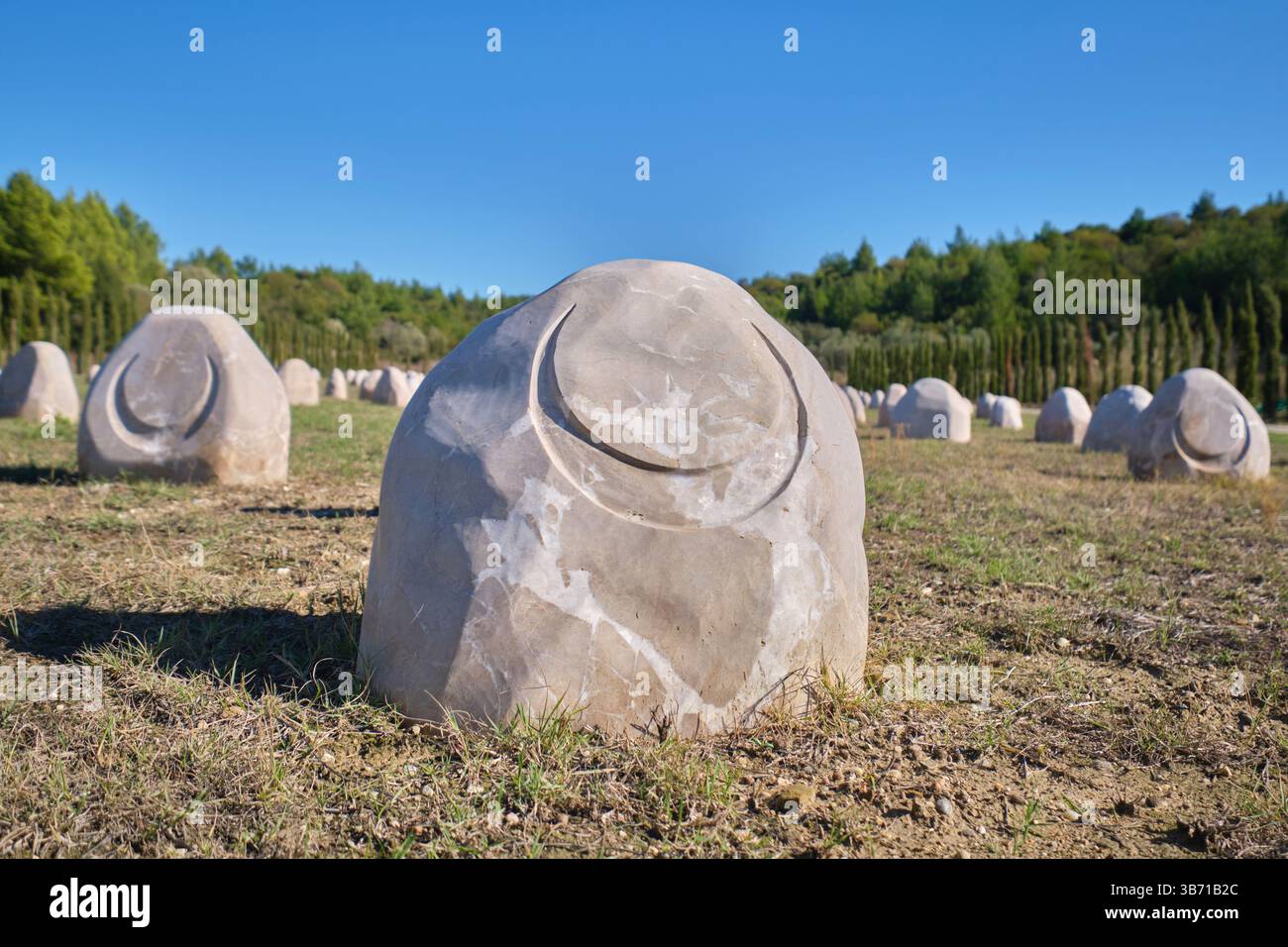 One of the stone, rough rock graves with crescent symbol carved into it ...