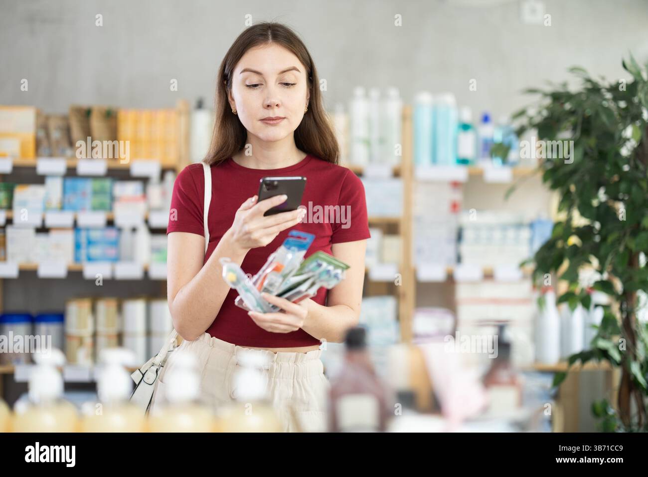 Young woman client scanning hi-res stock photography and images - Alamy