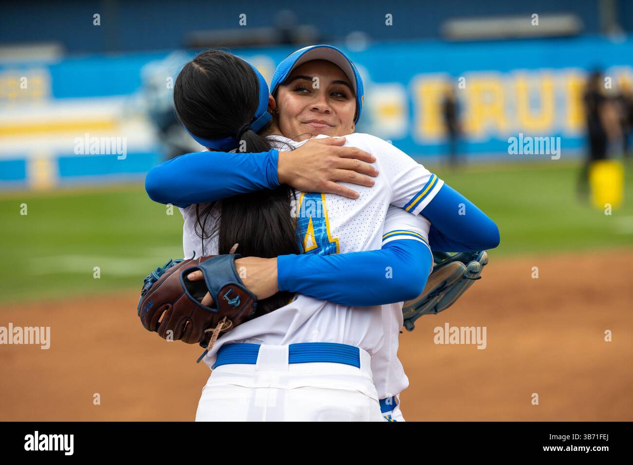 May 4, 2025: UCLA's Savannah Pola (5) hugs Kate Blunt (44) prior to ...