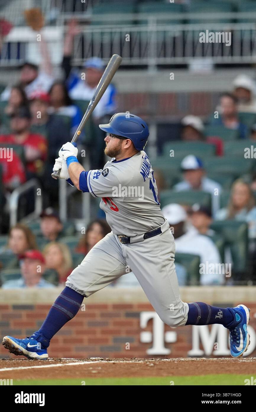 Los Angeles Dodgers third baseman Max Muncy (13) hits an RBI-double ...