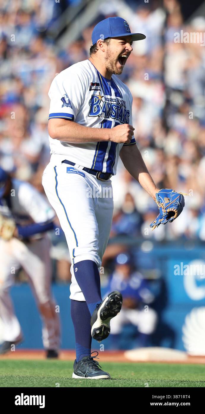 Yokohama DeNA Baystars starting pitcher Trevor Bauer reacts after the left fielder Tatsuo Ebina ...